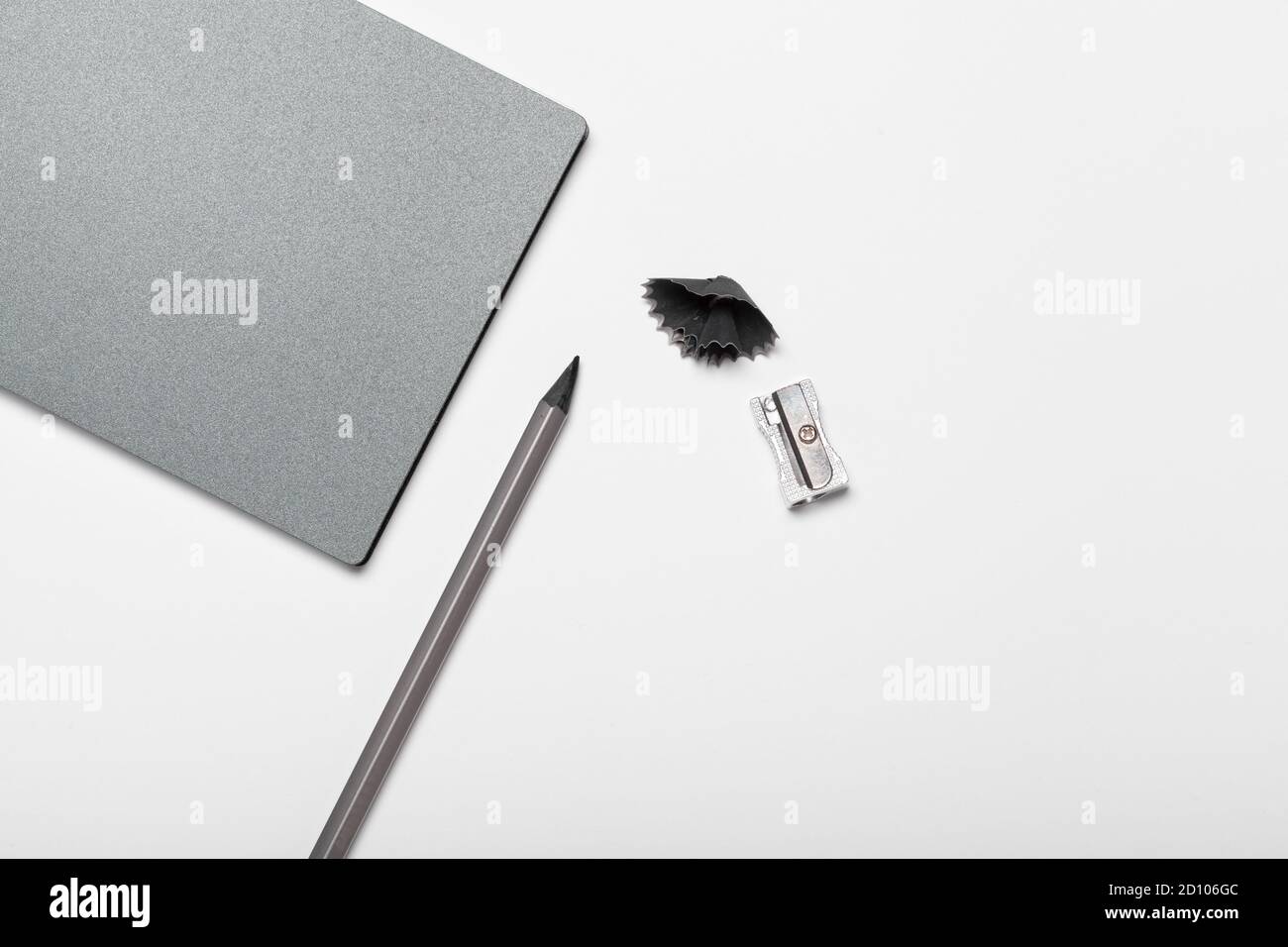 Grey notepad and pencil on working table top view Stock Photo - Alamy