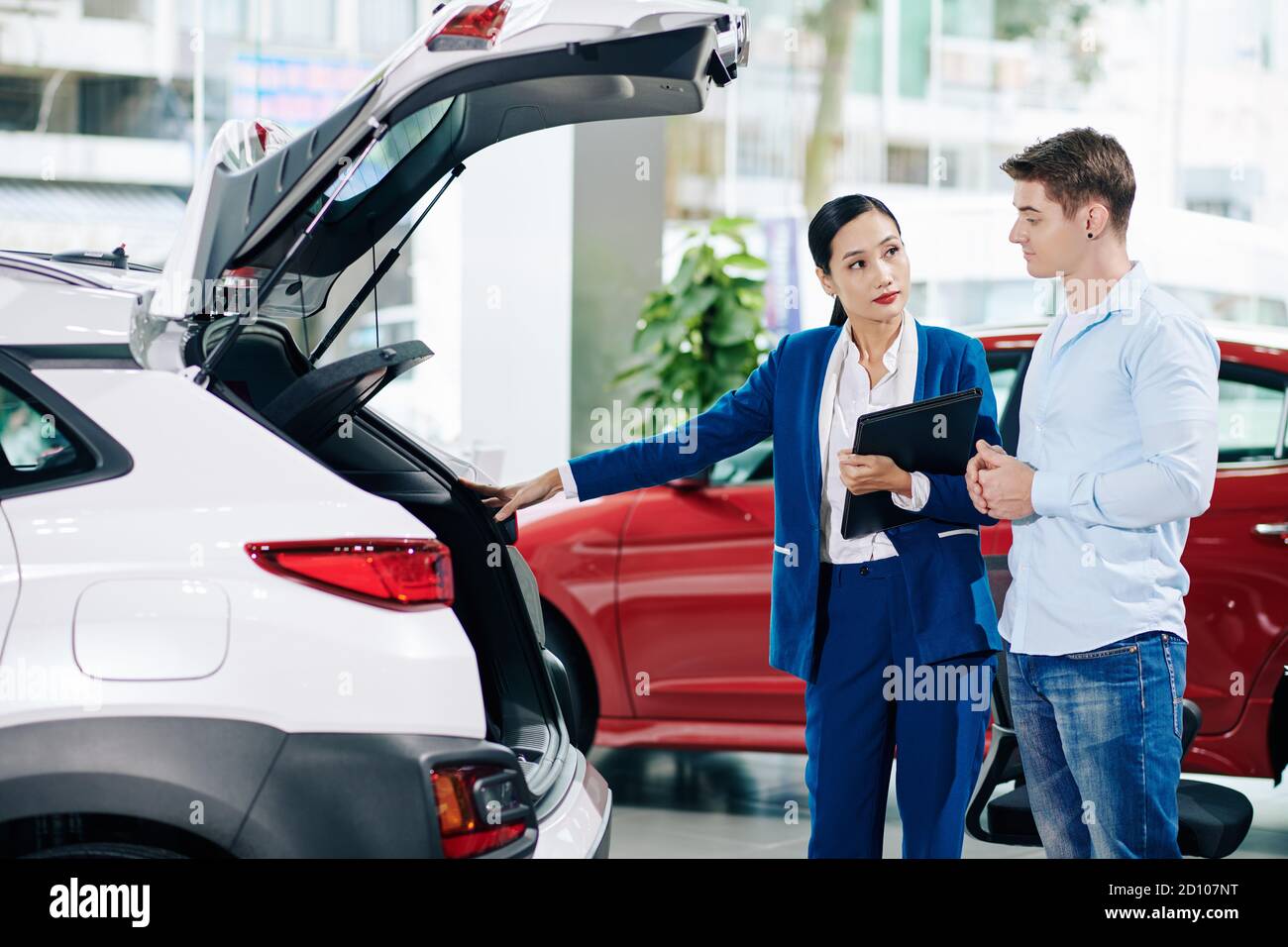 Showing automobile to customer Stock Photo - Alamy