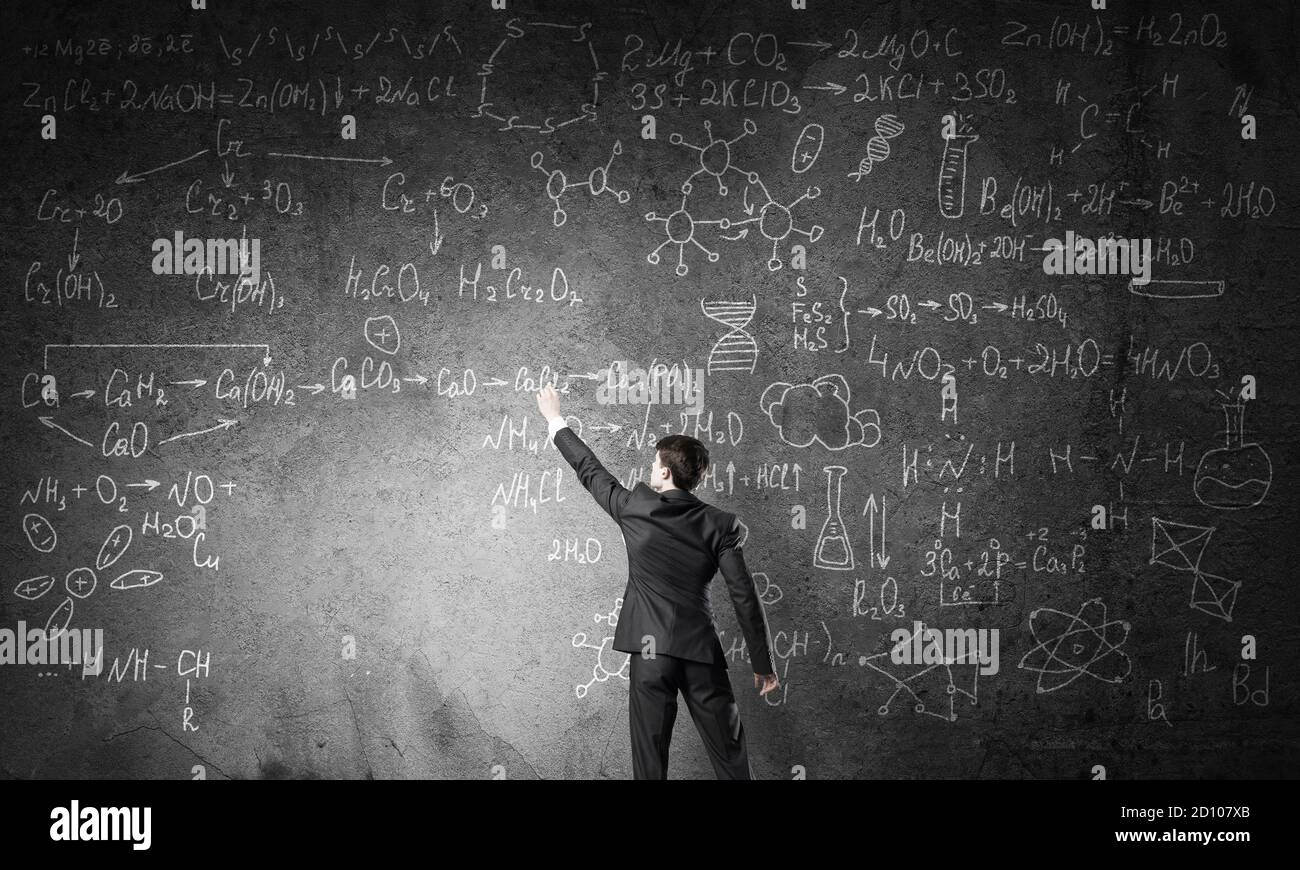 Hand scientist writing formulas hi-res stock photography and images - Alamy