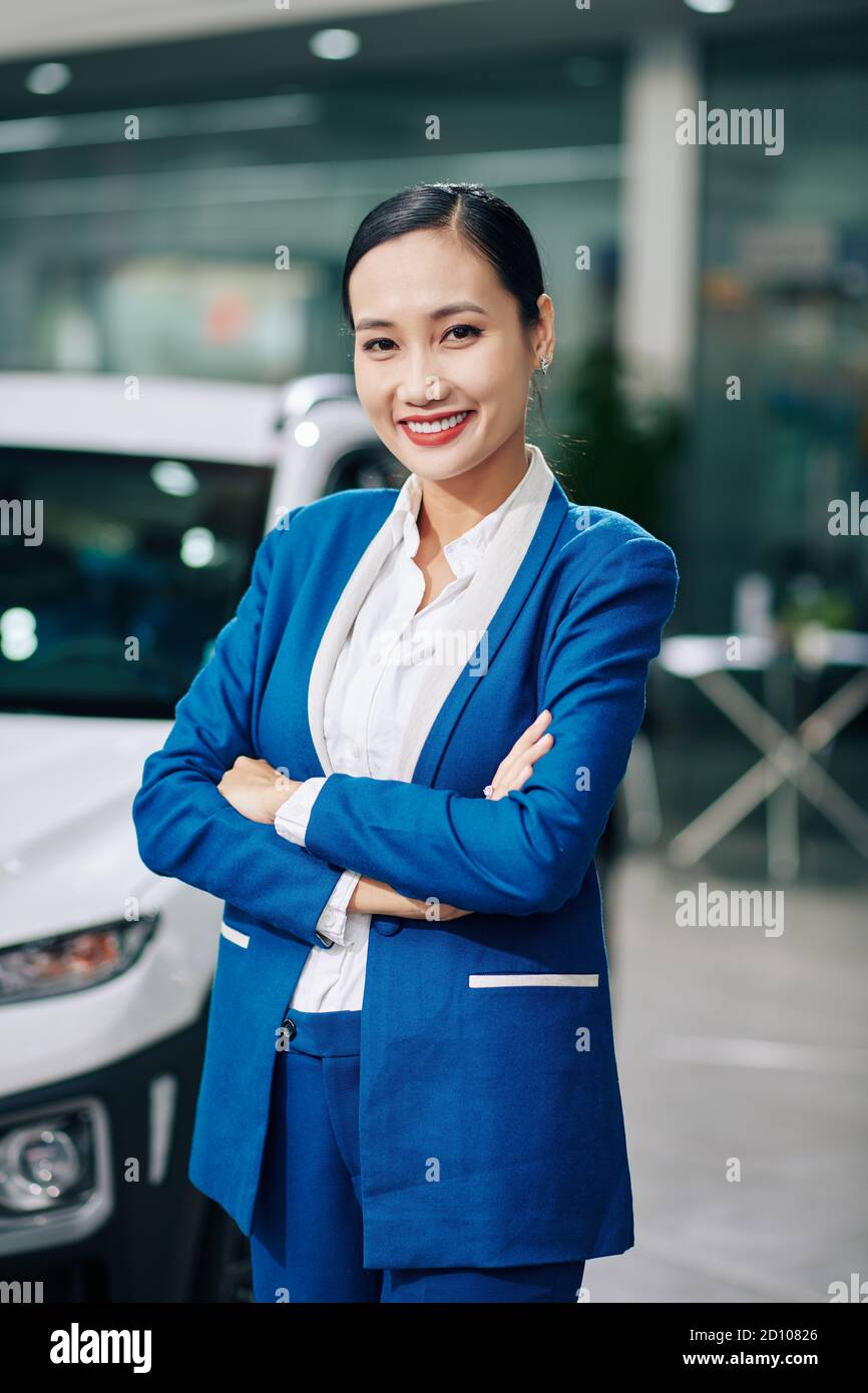Confident car dealership manager Stock Photo - Alamy