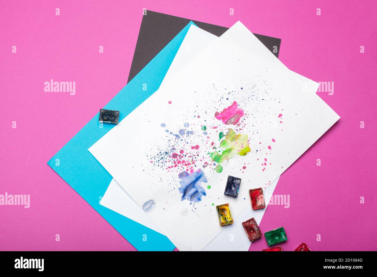 Watercolor paint set with swatches of paint splatter on paper Stock ...
