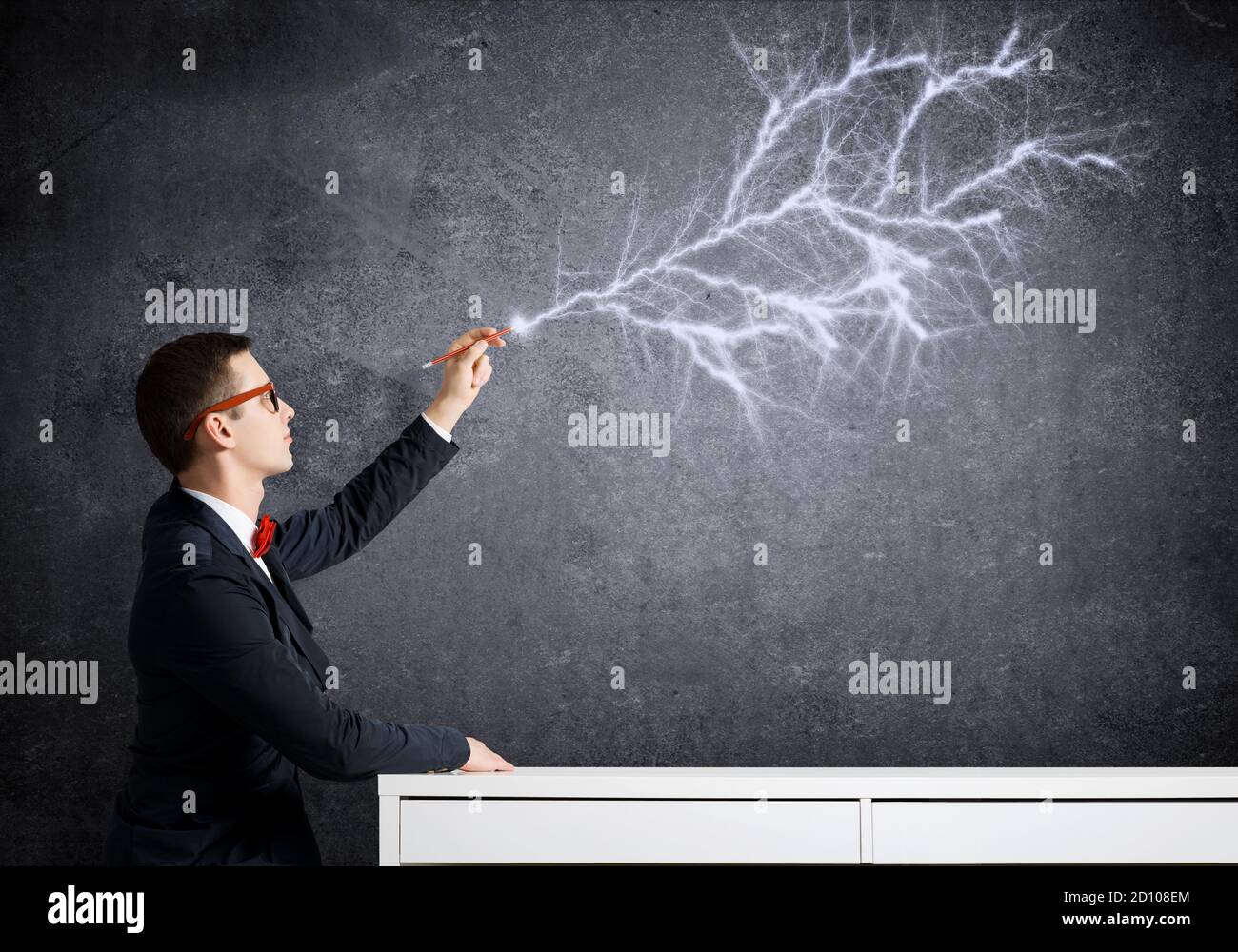Smart guy draw on wall Stock Photo - Alamy