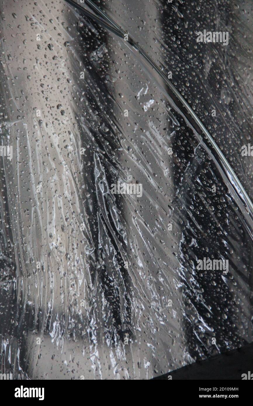 Photography image of drops of water on umbrella on rainy day in London ...