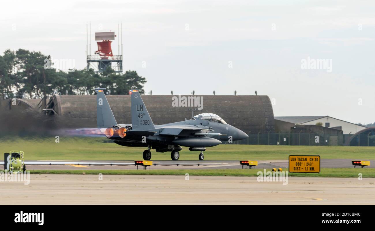 F-15E Strike Eagle, after burners lit, rolling down the runway at full ...