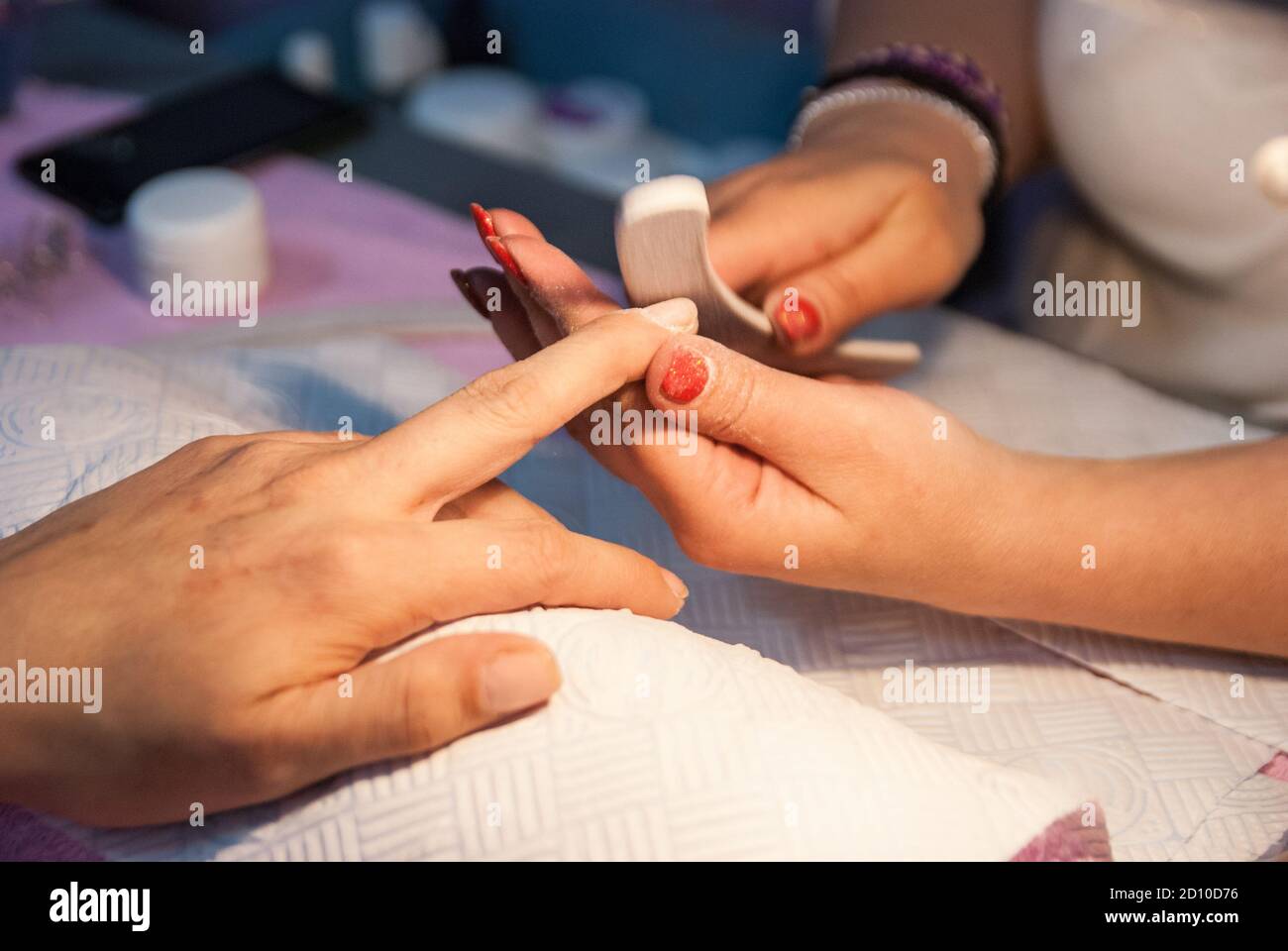 Worker doing a manicure in nail saloon Stock Photo - Alamy