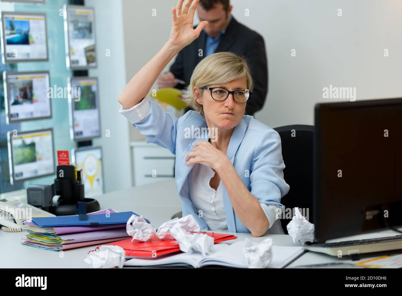angry office worker looking at screen Stock Photo - Alamy