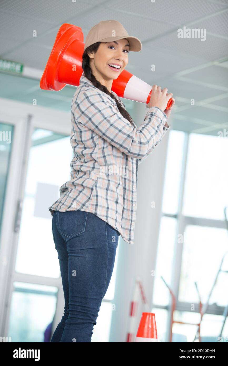 picture of woman holding traffic cone Stock Photo - Alamy