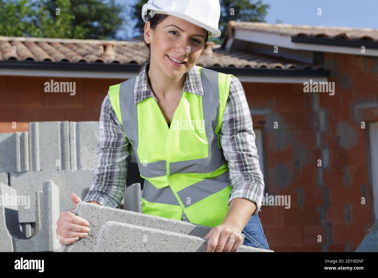 Woman mixing cement hi-res stock photography and images - Alamy