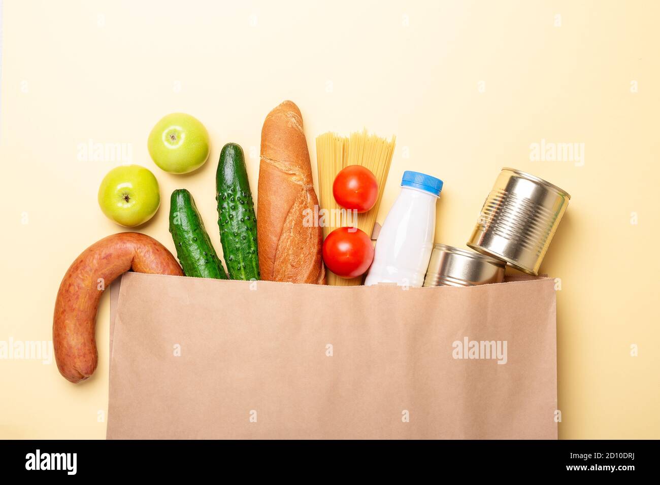 Delivery food from the supermarket. Paper bag full of food. Top view ...