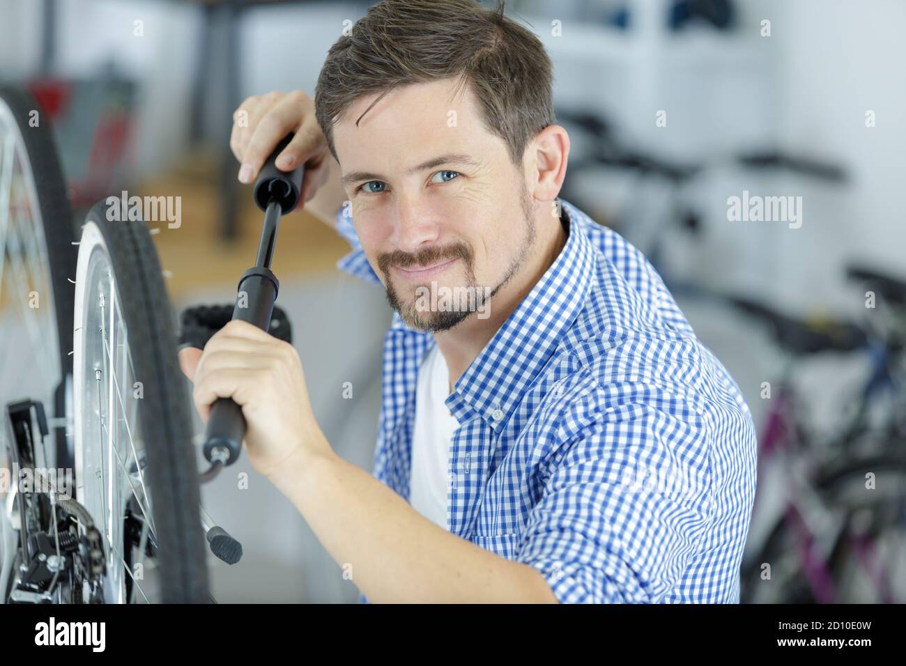 Man inflating bicycle tire pump hi-res stock photography and images - Alamy