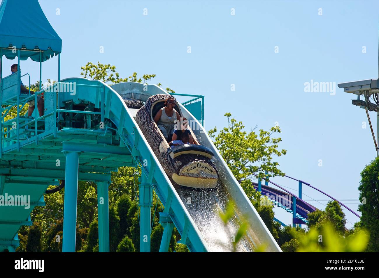 flume roller coaster, starting descent, people screaming, amusement ...