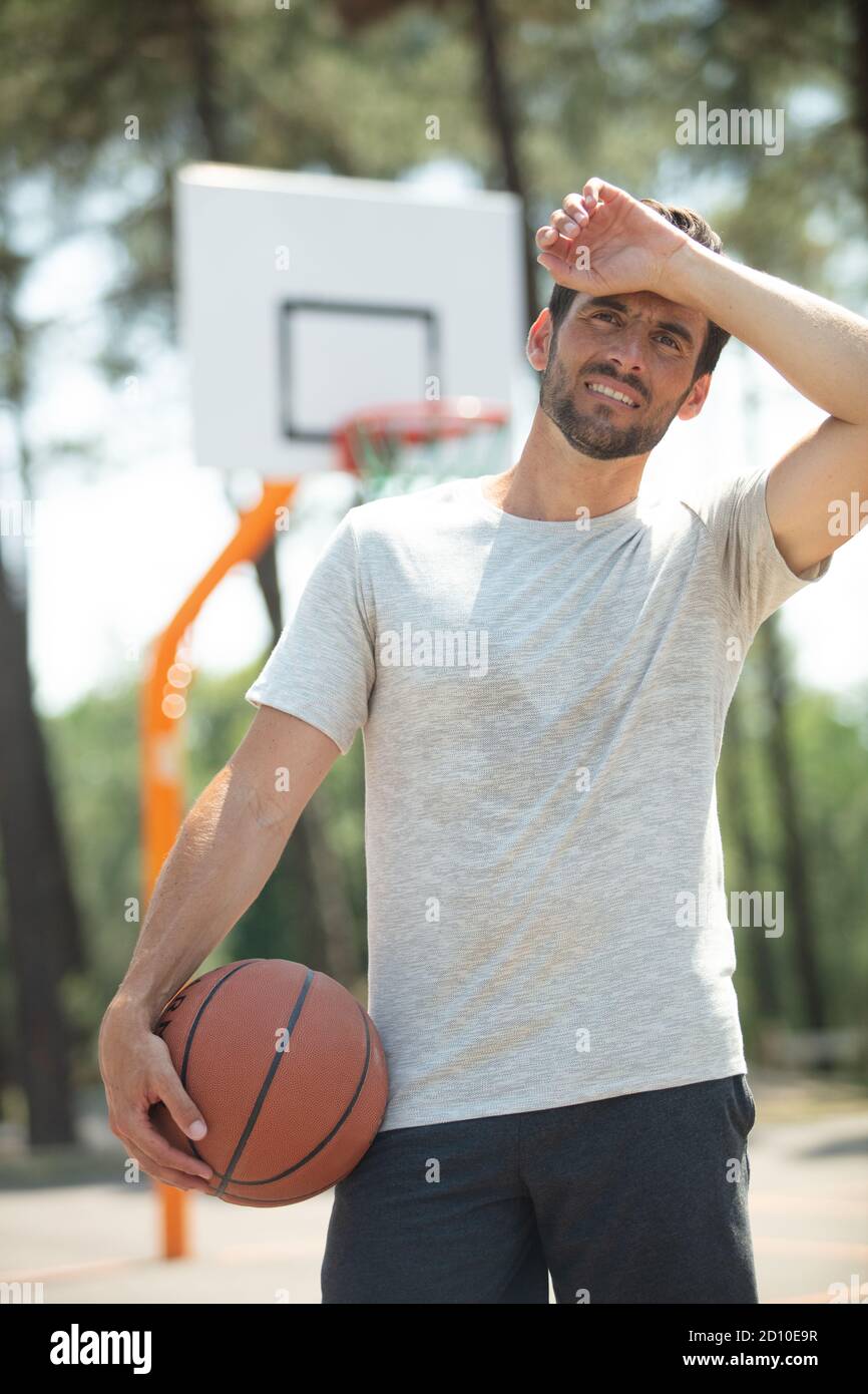 Tired man playing basketball hi-res stock photography and images - Alamy