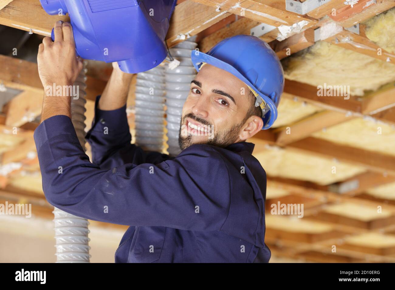 contractor installing plastic ventilation system Stock Photo - Alamy