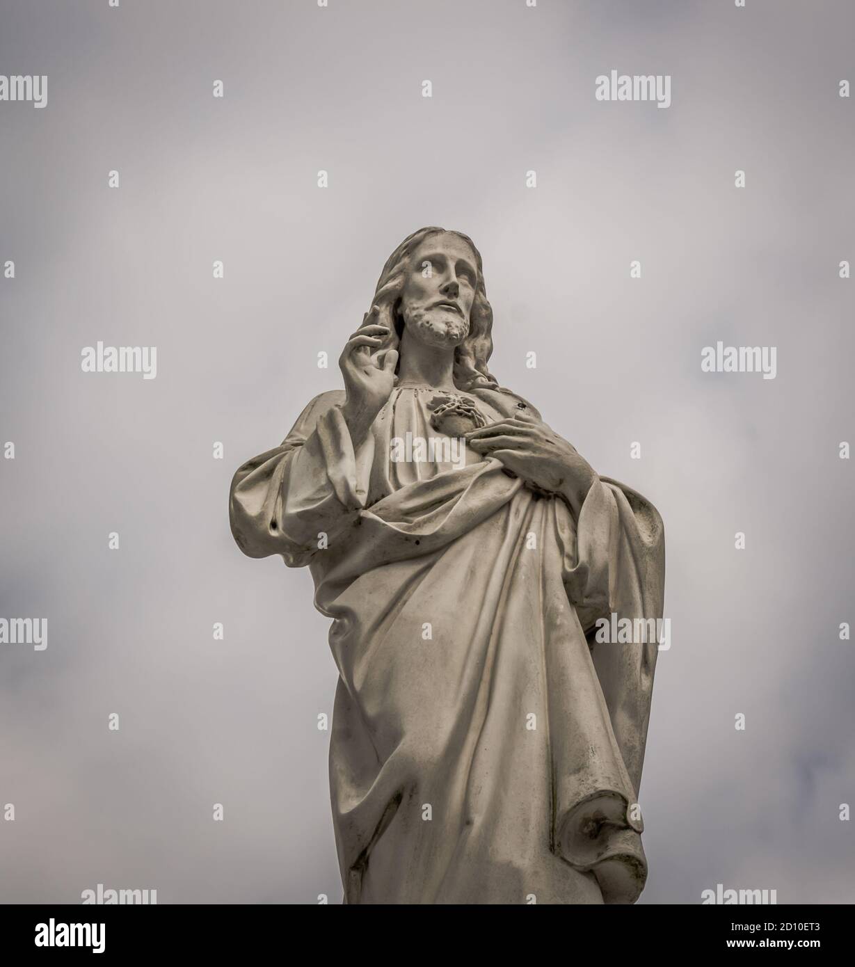 Low angle shot of the Jesus statue with raised fingers on a cloudy day ...