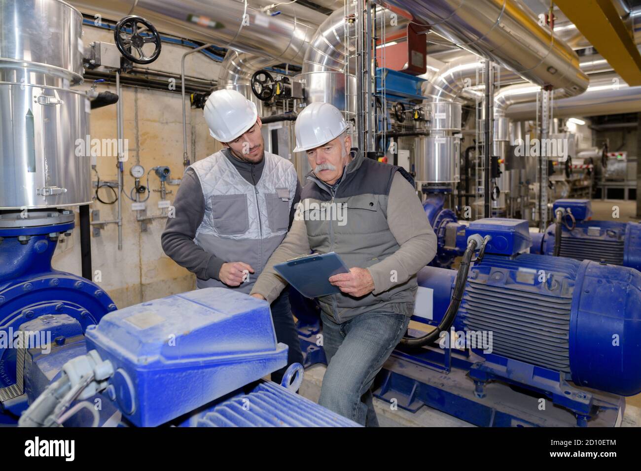 working at a pipes factory Stock Photo - Alamy