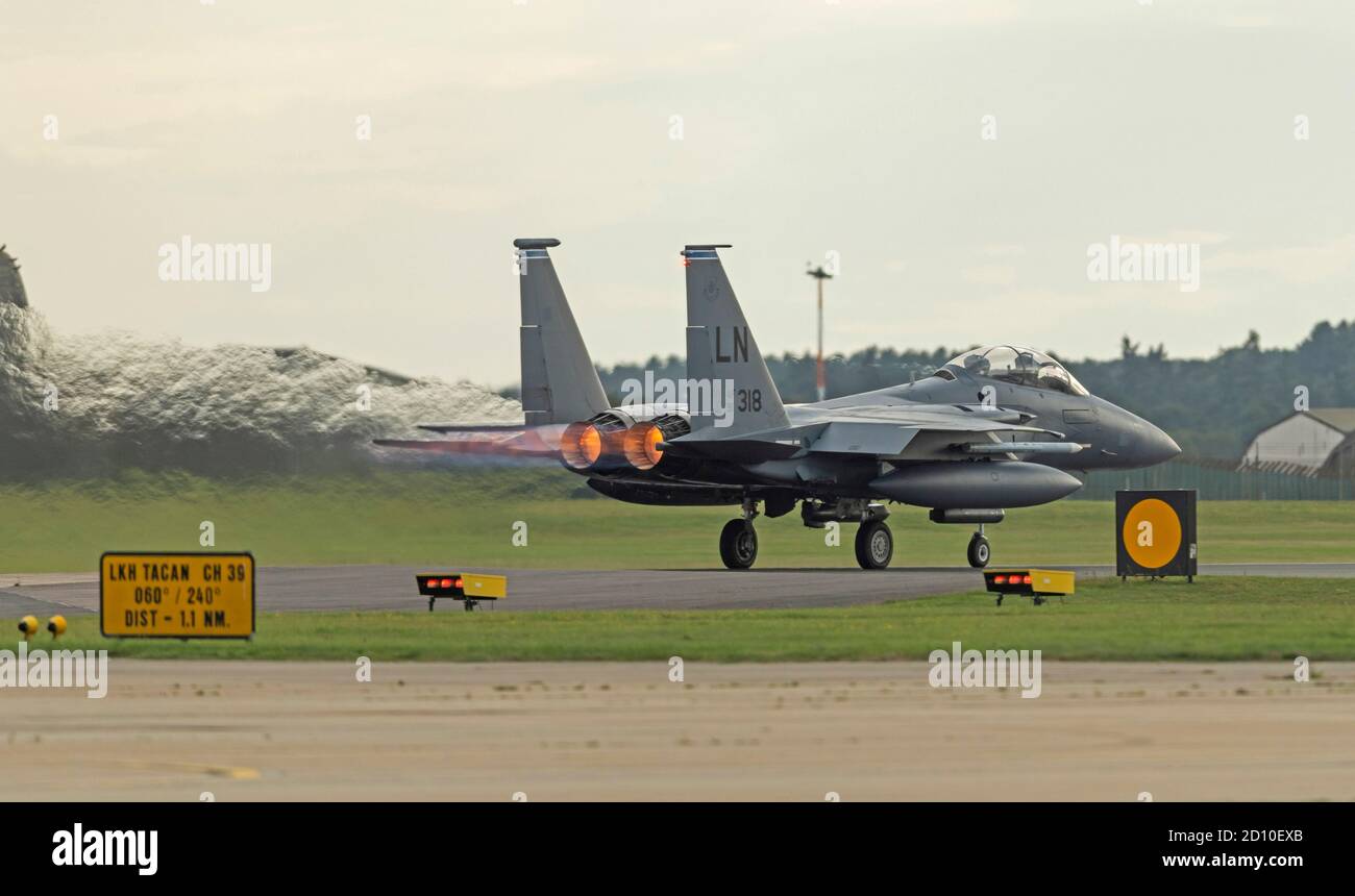 F-15E Strike Eagle, after burners lit, rolling down the runway at full ...