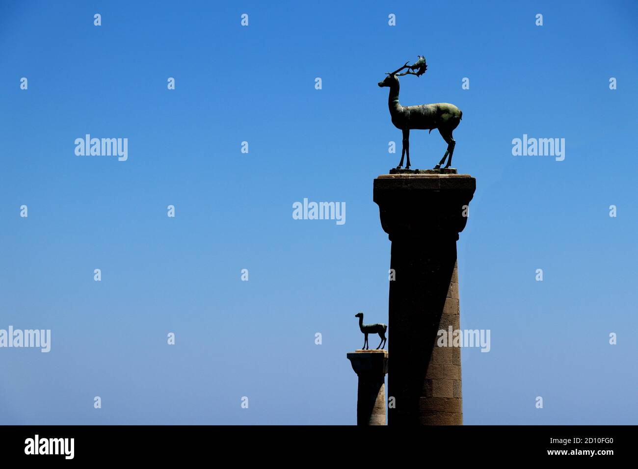 Rhodes symbol at the entrance to Rhodes Mandraki harbor Stock Photo - Alamy