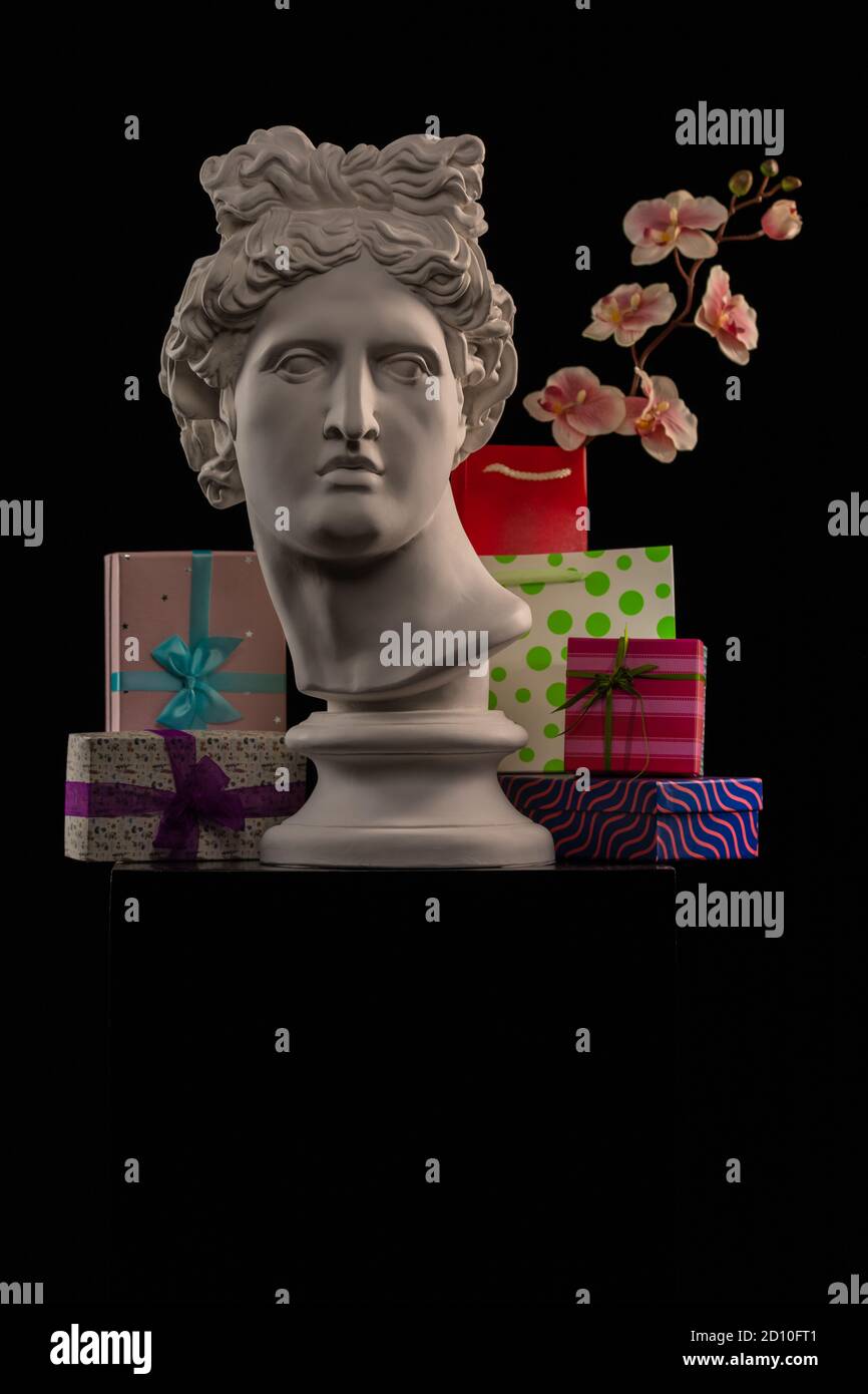 Statue of Apollo Belvedere, flowers and gifts boxes and packages ...