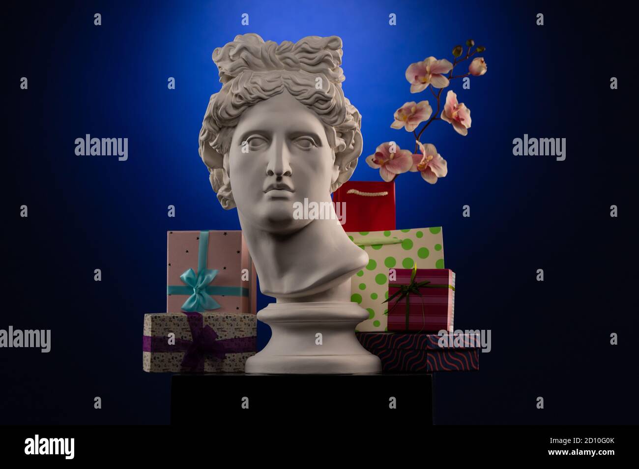 Statue of Apollo Belvedere, flowers and gifts boxes and packages ...