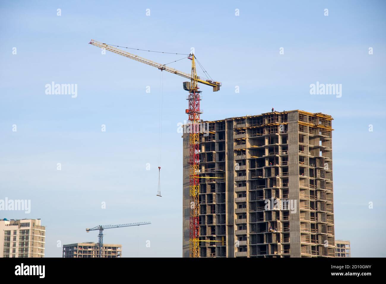 Tower crane lifts the block for building under construction at ...