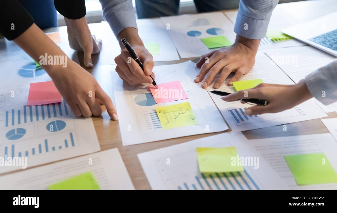 Close up diverse business people writing notes on stickers Stock Photo ...