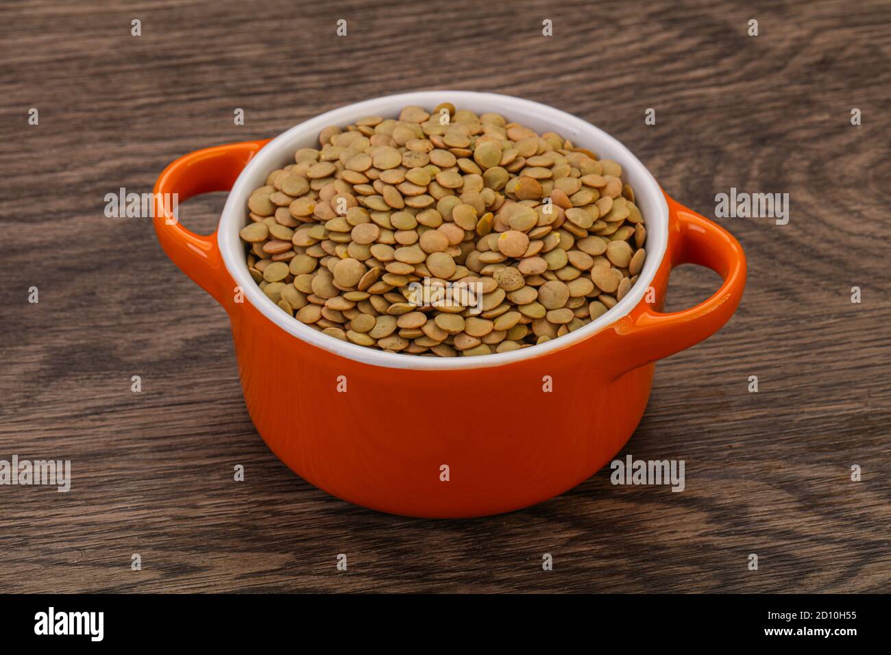 Vegan cuisine - Dry lentil heap isolated Stock Photo - Alamy