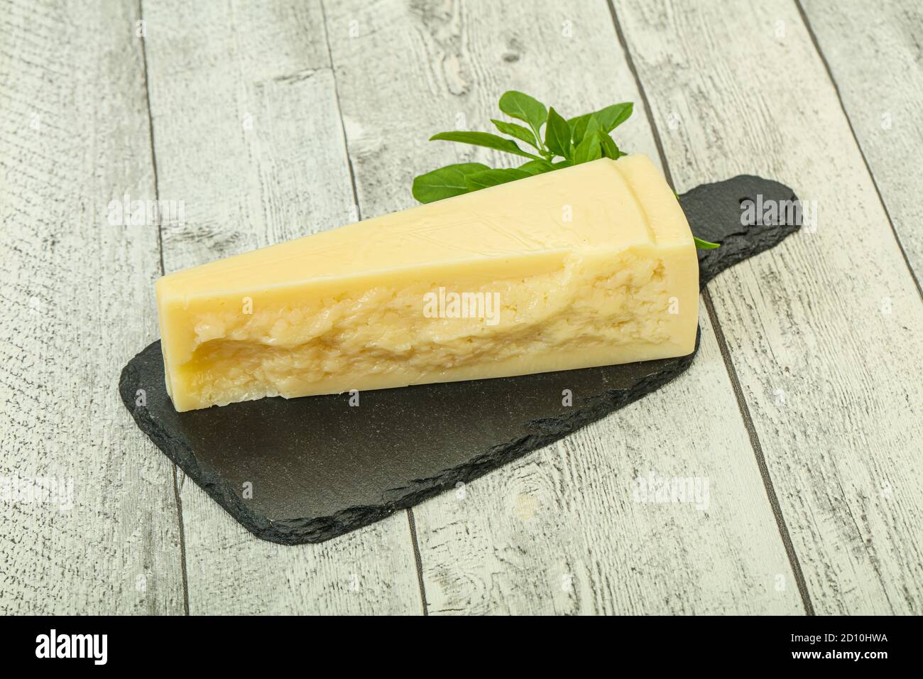 Hard parmesan cheese served basil leaves Stock Photo - Alamy
