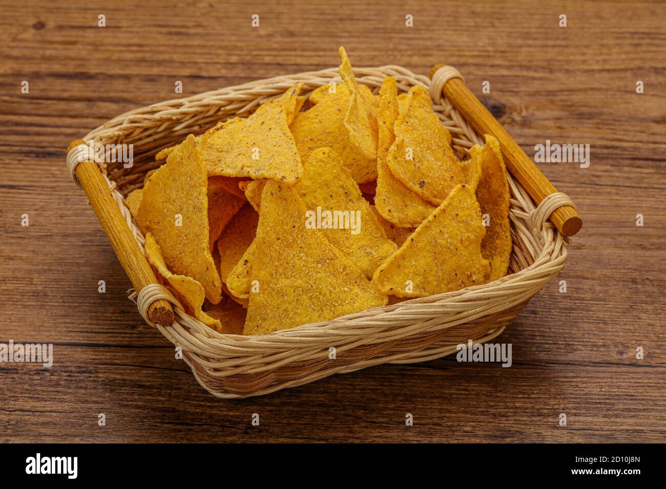 Mexican crunchy corn nachos triangle heap Stock Photo - Alamy