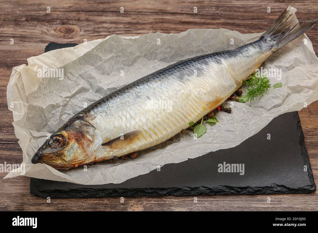 Salted Herring fish with pepper and spices Stock Photo - Alamy