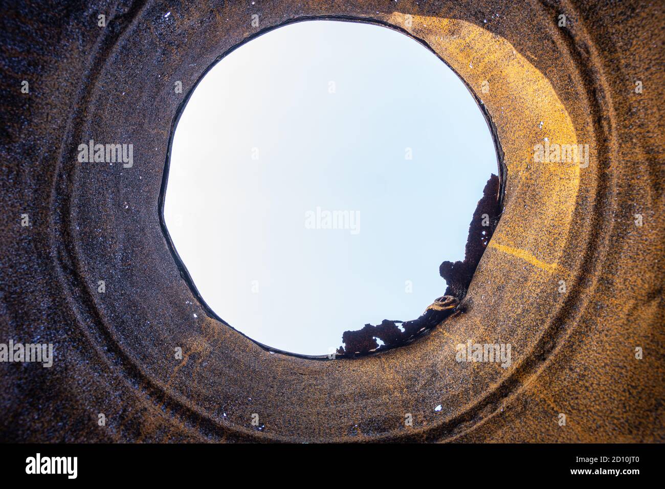 hole in a rusty barrel inside view Stock Photo - Alamy