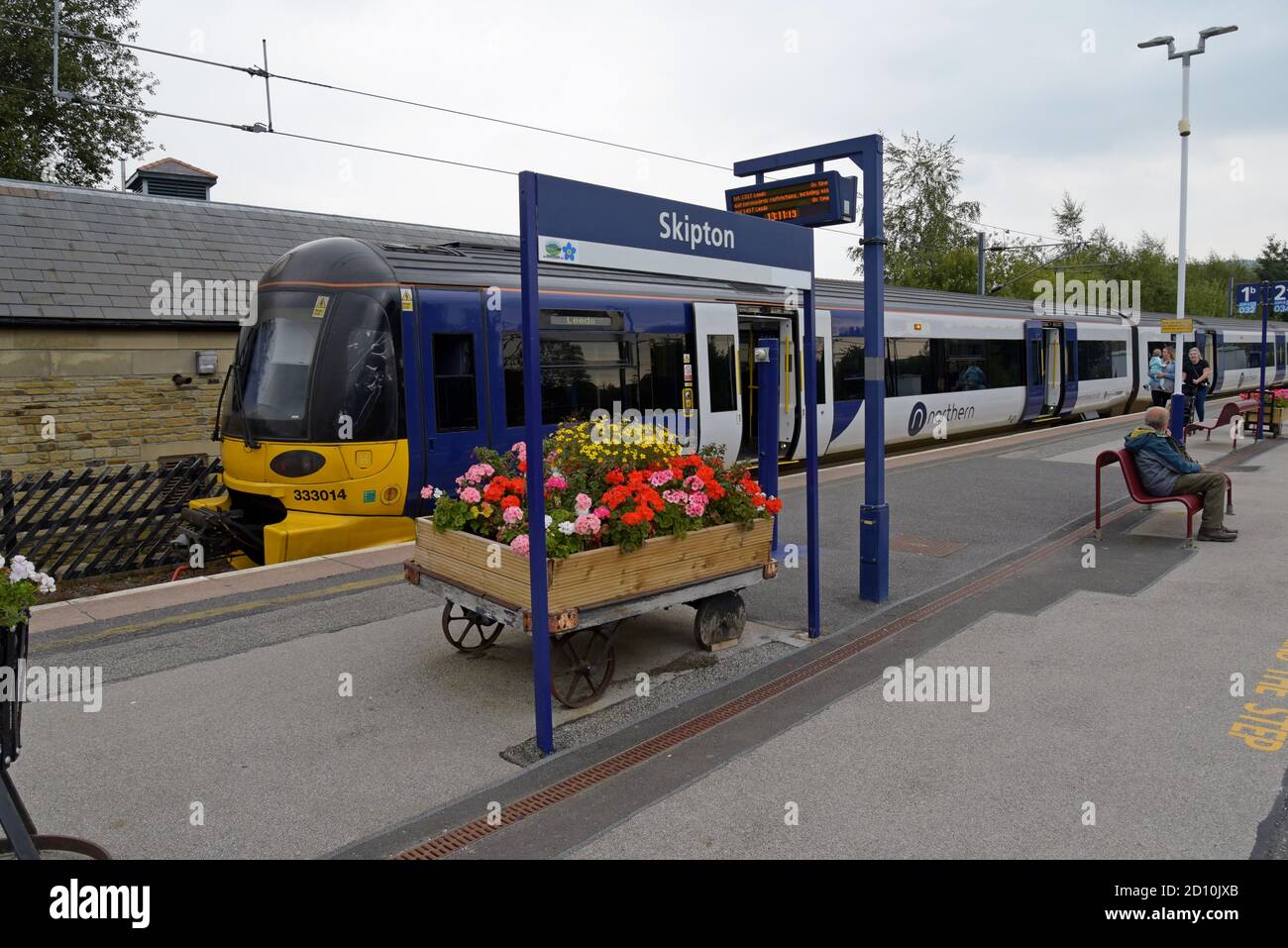 Passengers leaving a class 333 diesel train operated by Northern trains ...
