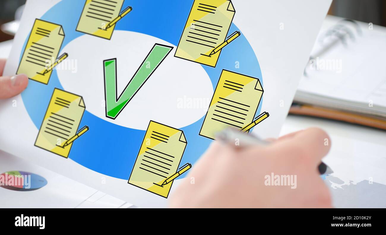 Hands holding a paper showing a document validation concept Stock Photo ...