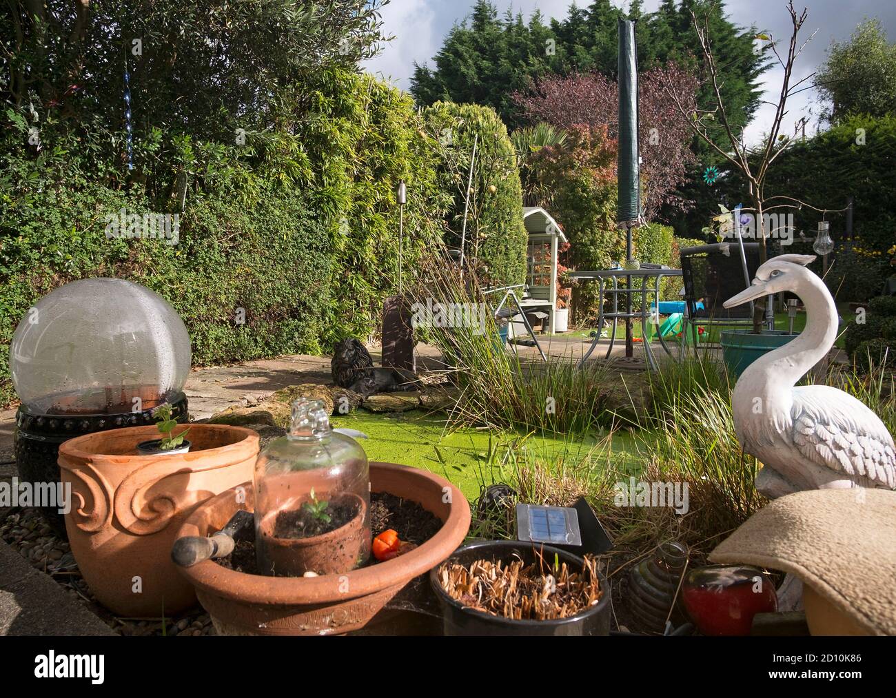 Cluttered garden image Stock Photo - Alamy