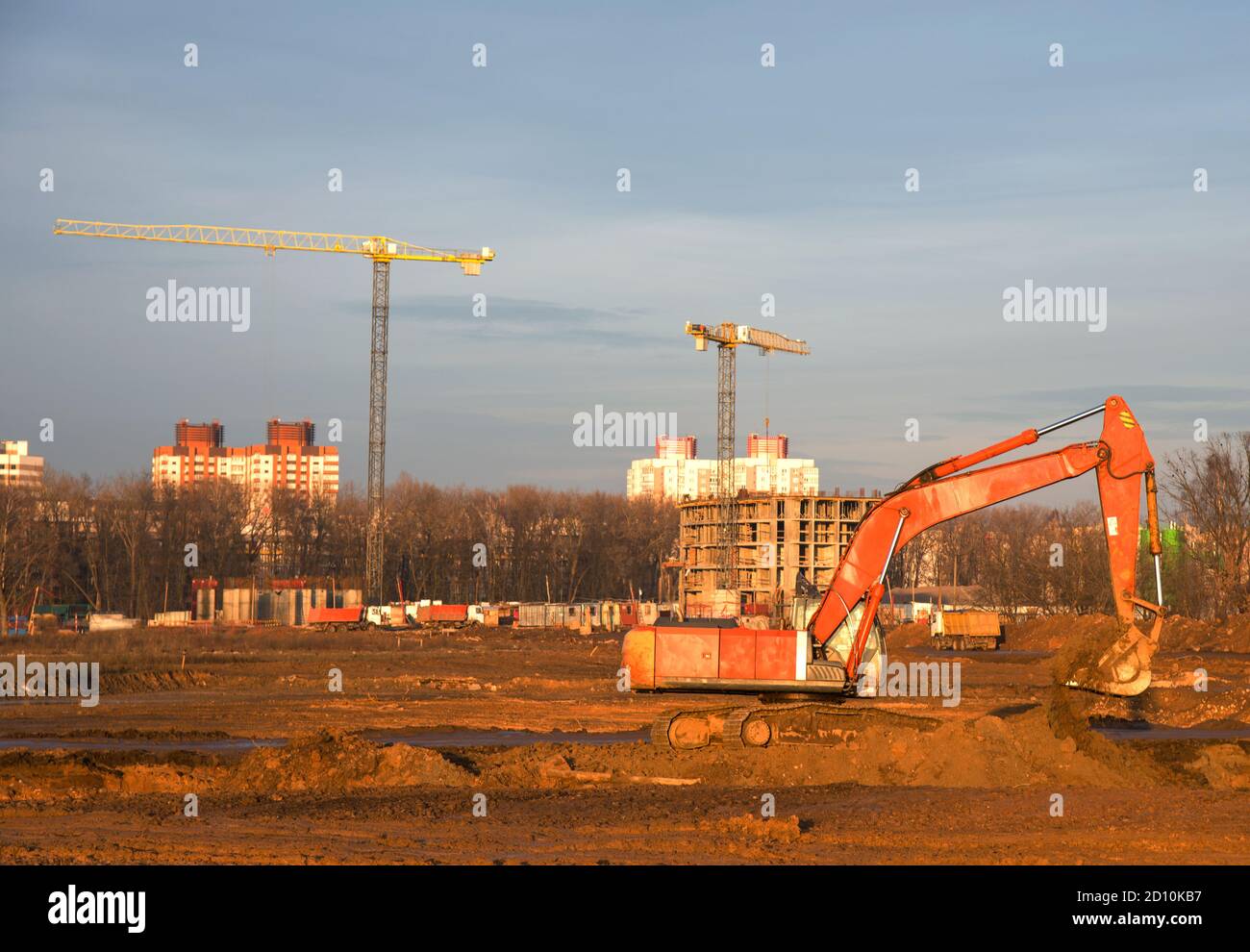 Excavator with a large iron bucket on a construction site during road ...