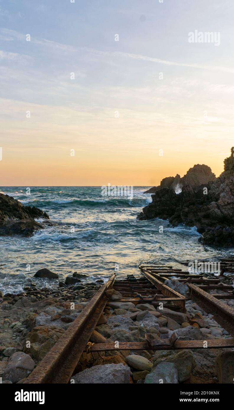 train tracks entering the beach Stock Photo - Alamy
