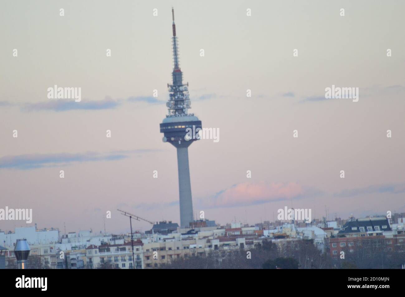 Far view of a telecommunications tower in the city at dawn Stock Photo ...