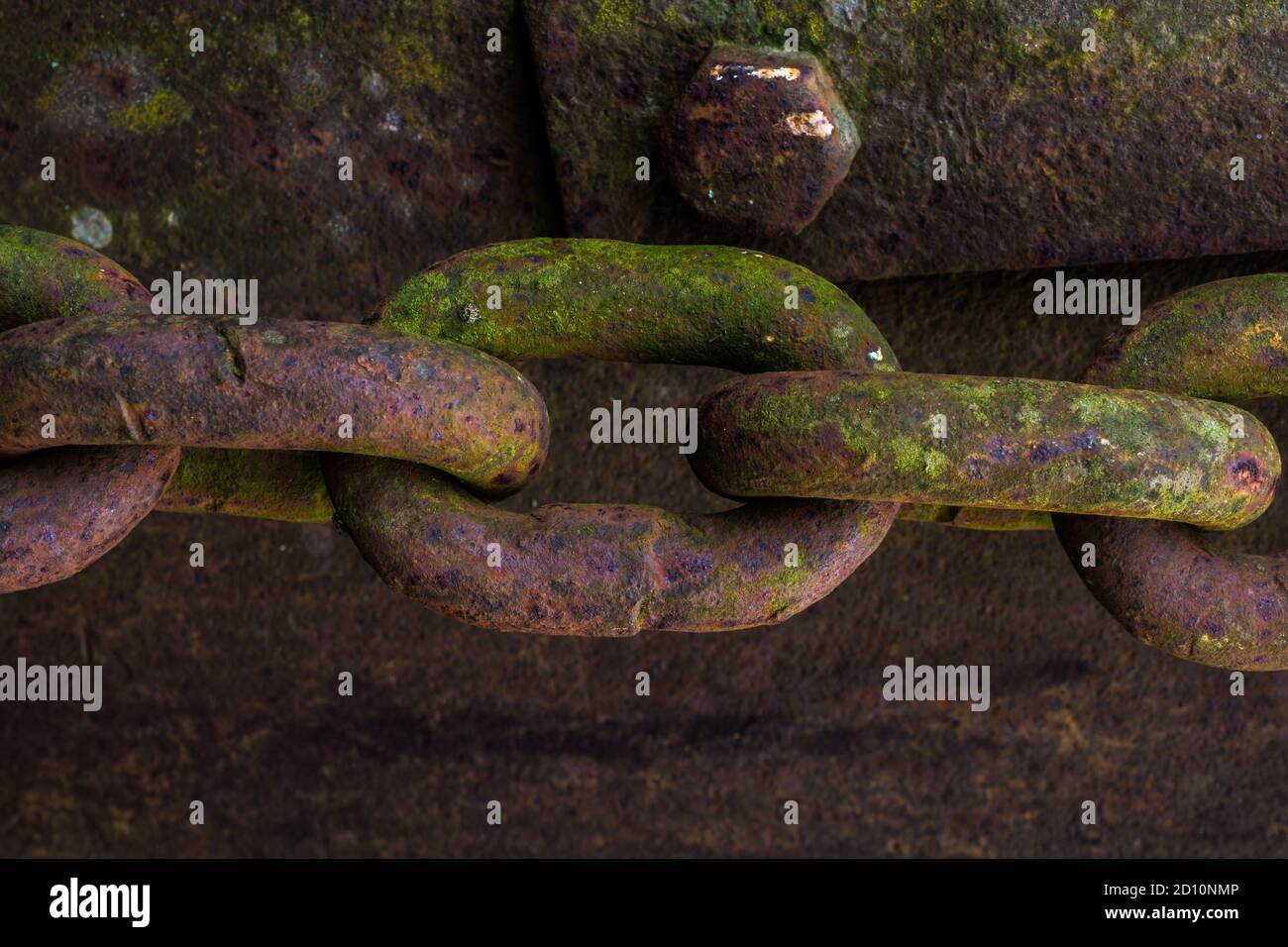 Abandoned industrial chain under tension Stock Photo - Alamy