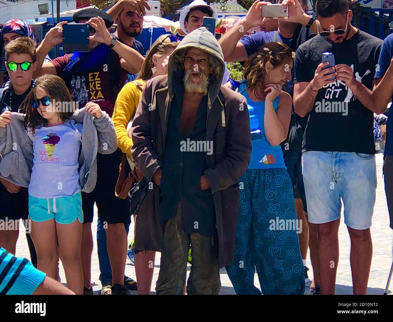 A homeless man among tourists. summer holidays Stock Photo - Alamy