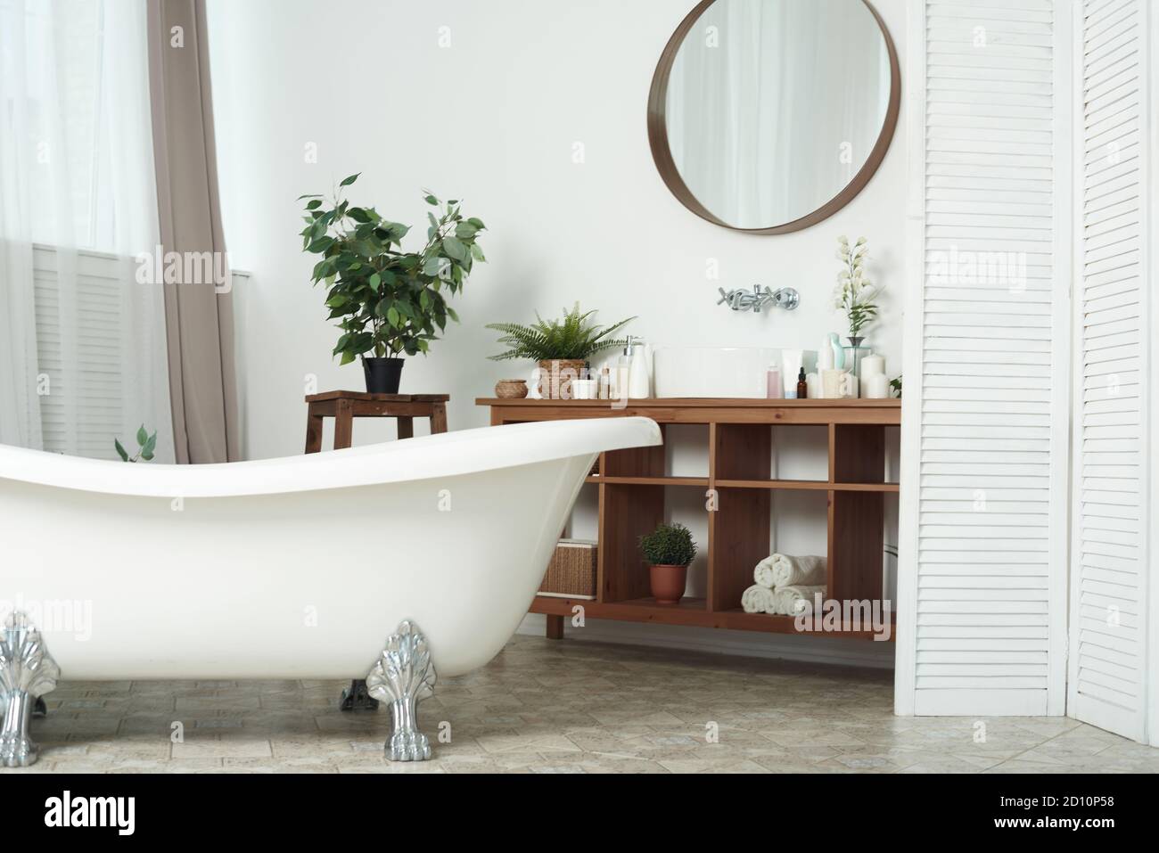 Modern stylish bathroom without anyone. Front view of white modern bath ...
