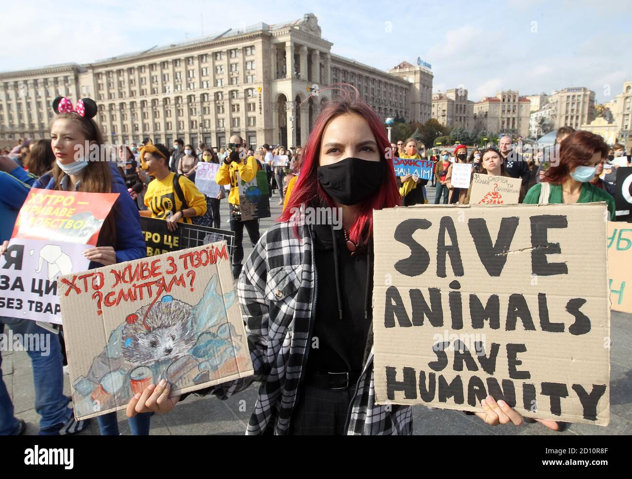 An activist holding animal rights placards during the demonstration.At ...