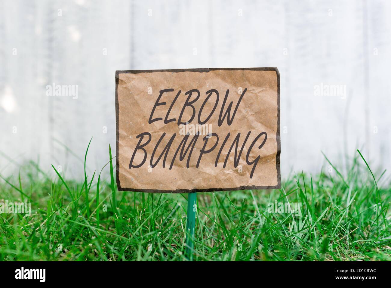 Handwriting text writing Elbow Bumping. Conceptual photo newlytrended ...