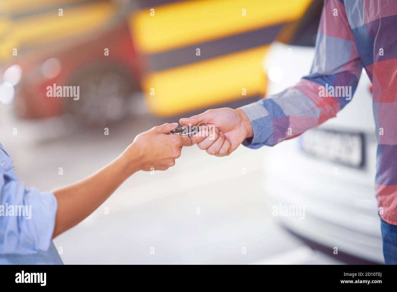 Car dealer giving keys to a customer Stock Photo - Alamy