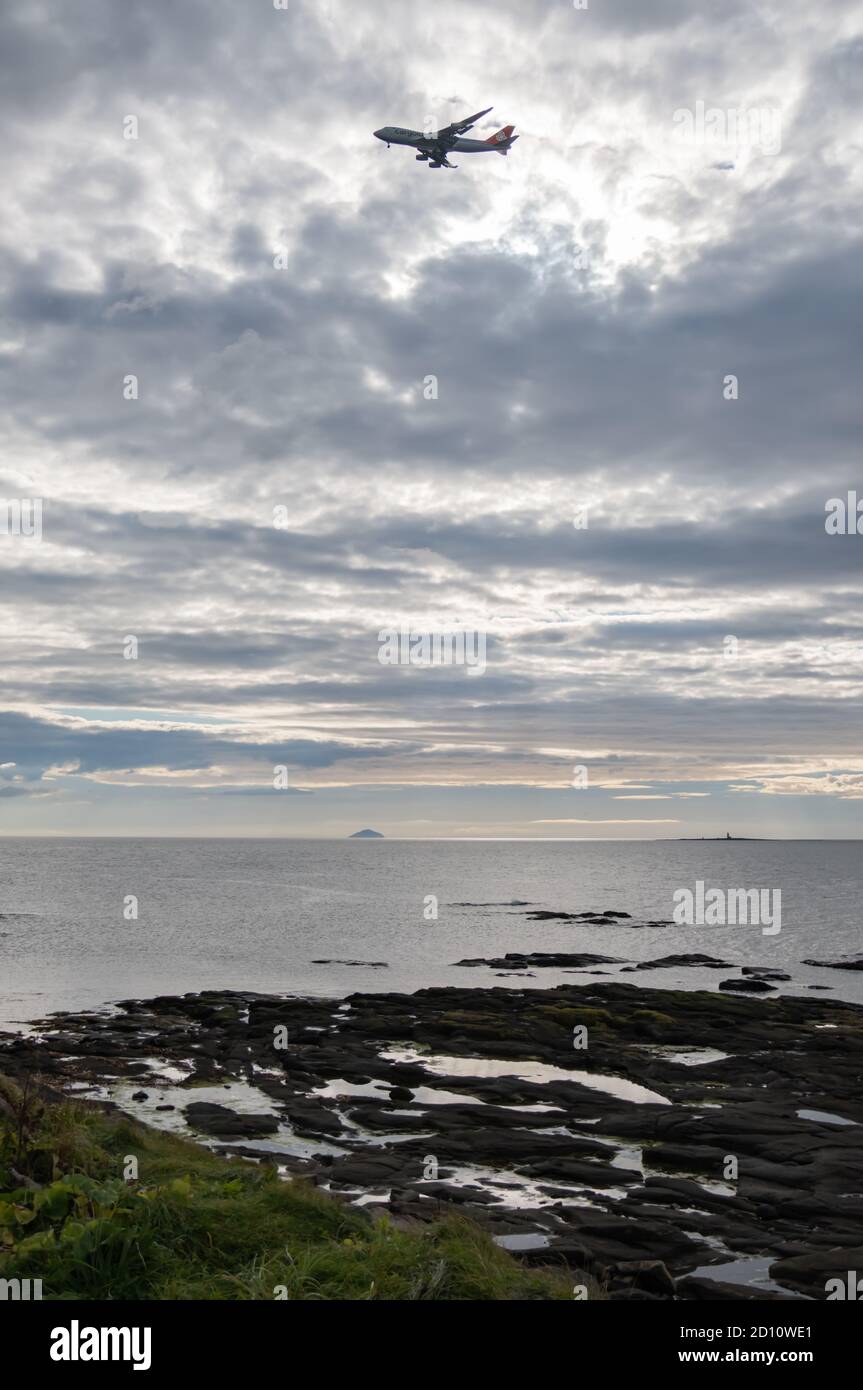 Troon, Scotland, UK. 4th October,, 2020. UK Weather: An aircraft flies ...