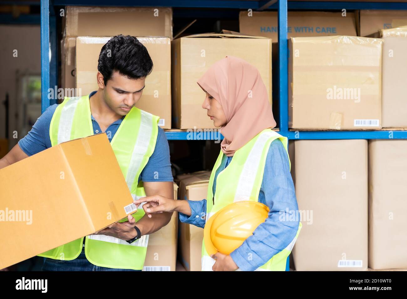 Islam asian warehouse worker working with Indian warehouse worker about ...