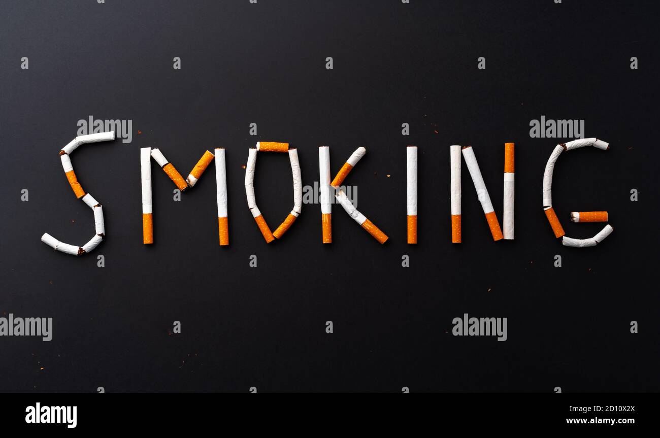 Inscription word SMOKING made out of cigarettes top view Stock Photo ...