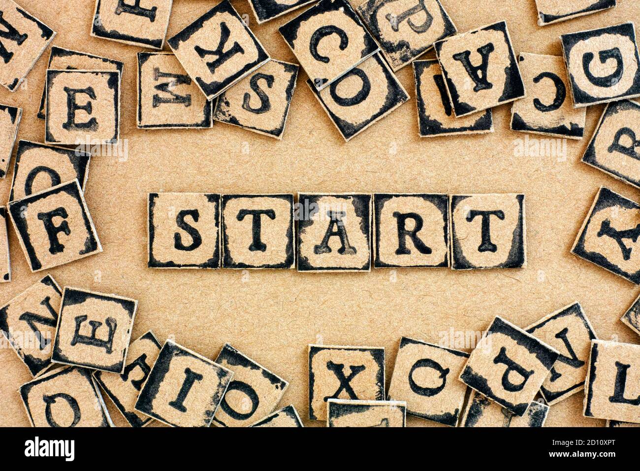 Word Start spelled out from cardboard letters made by black alphabet ...