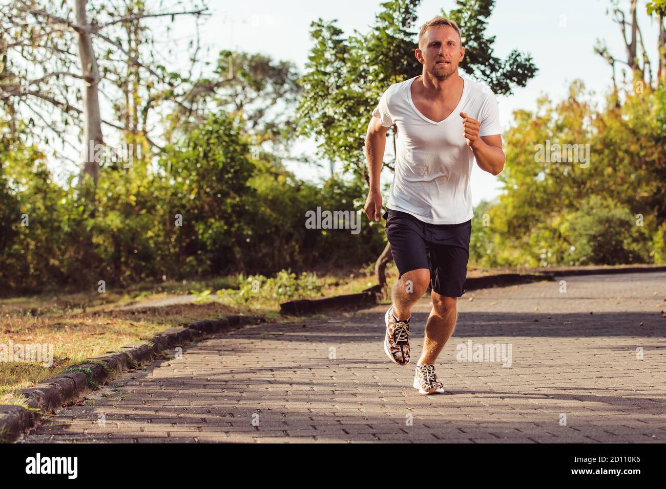 man running on the path in the park. High quality photo Stock Photo - Alamy
