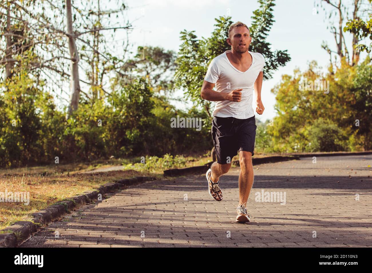 man running on the path in the park. High quality photo Stock Photo - Alamy