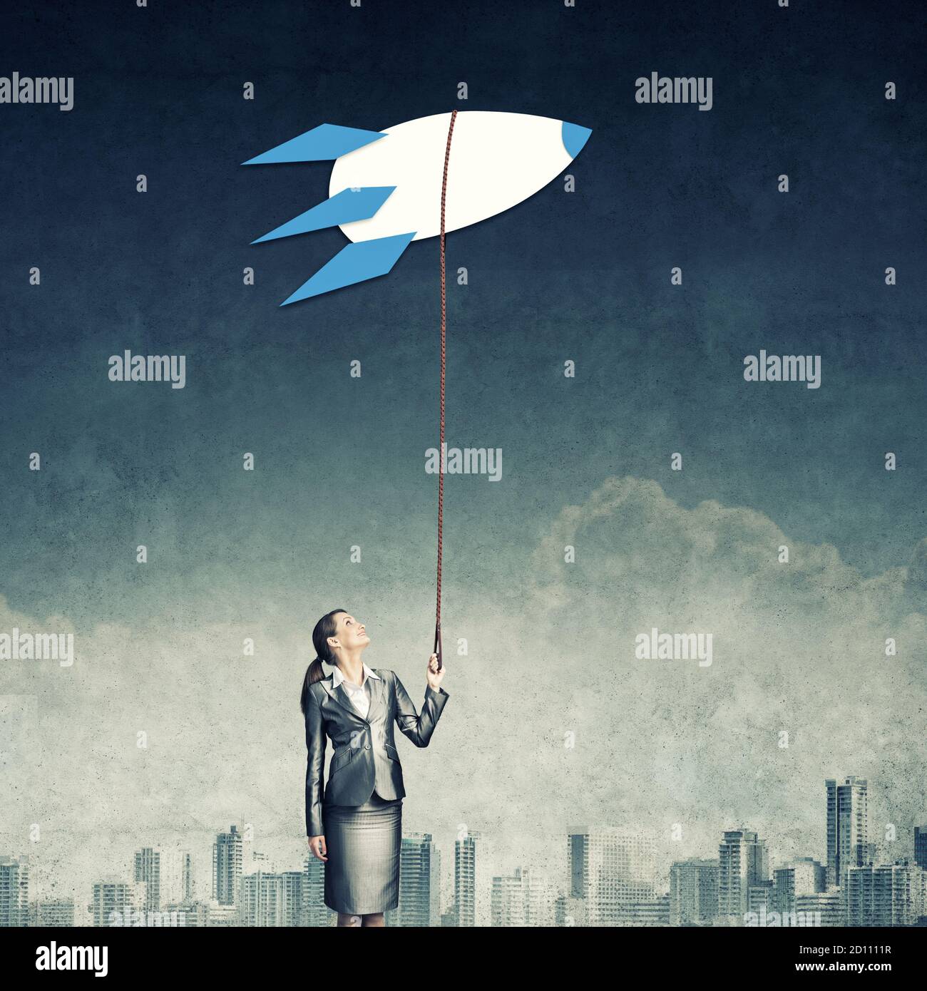 Woman catch rocket Stock Photo - Alamy