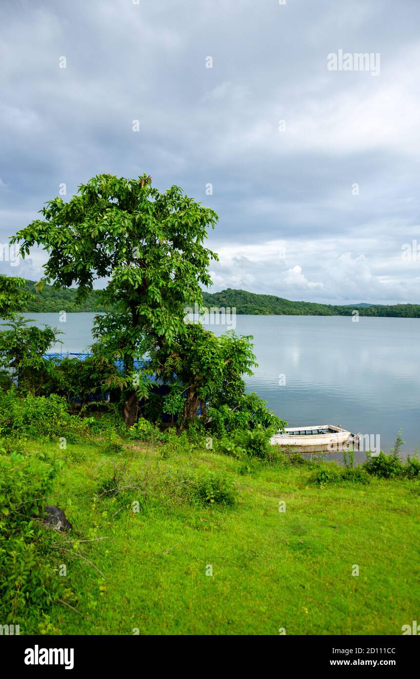 Serene view of Chapoli dam reservoir during monsoon season in Canacona ...